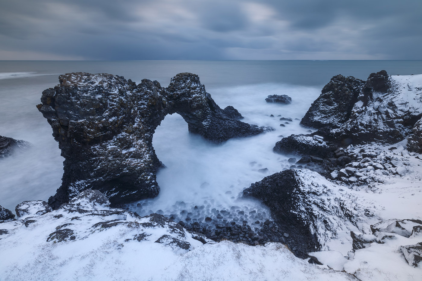 The Arch of Winter - The wonderful natural rock-arch of Gatklettur on a ...