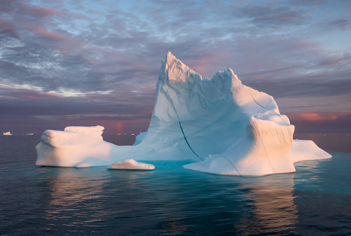 Pot o' Copper - An iceberg at sunset, accompanied by a distant, blood ...