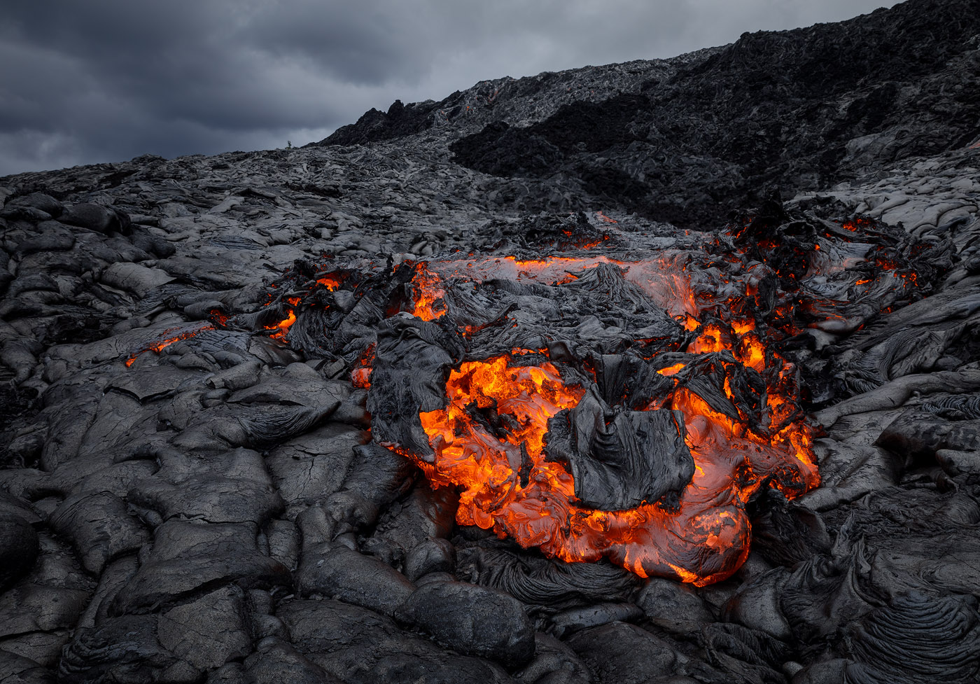 Amber-Colored Earth - Lava oozing down the slopes of Kilauea Volcano ...