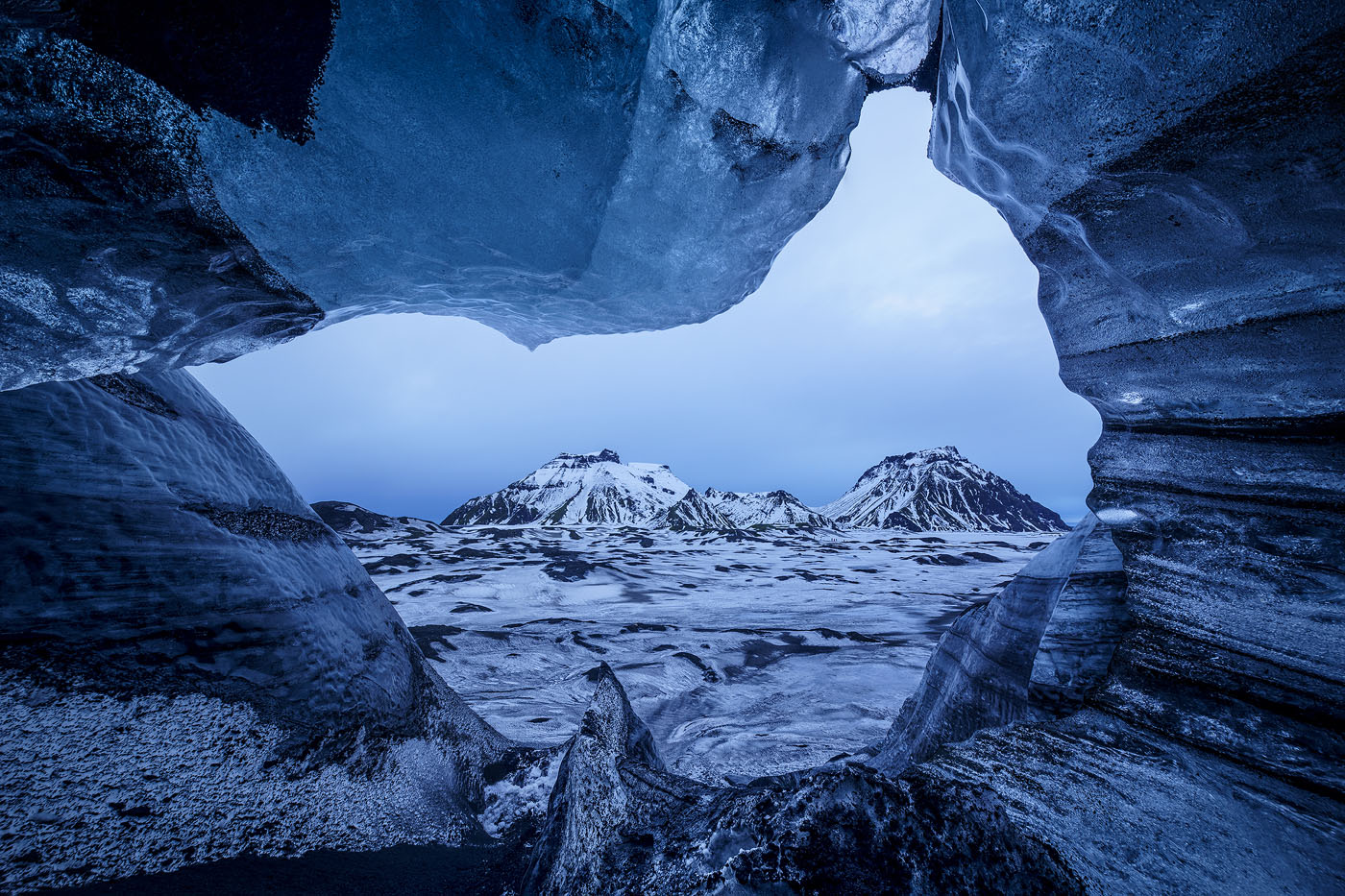 Canary Cave - opening to an elevated ice cave - frozen landscape at ...