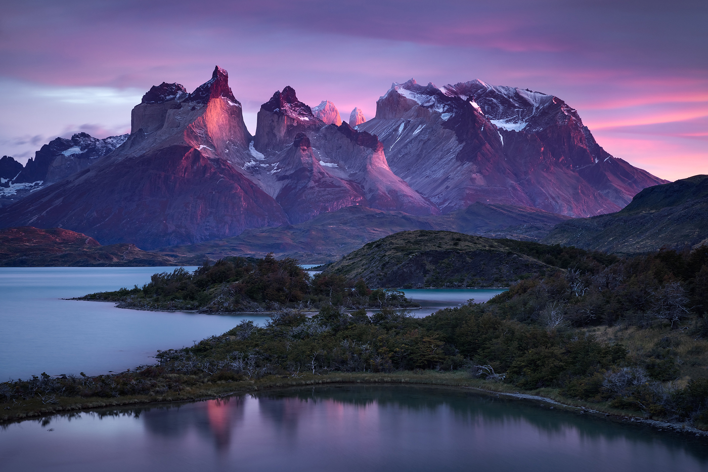 Cuernos Radiantes - Cuernos Del Paine during a pink sunrise, reflecting ...